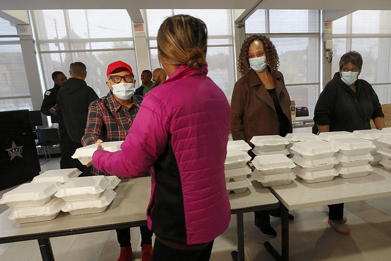 St. Sabina feeds migrants living at police station - Photos - Chicago ...